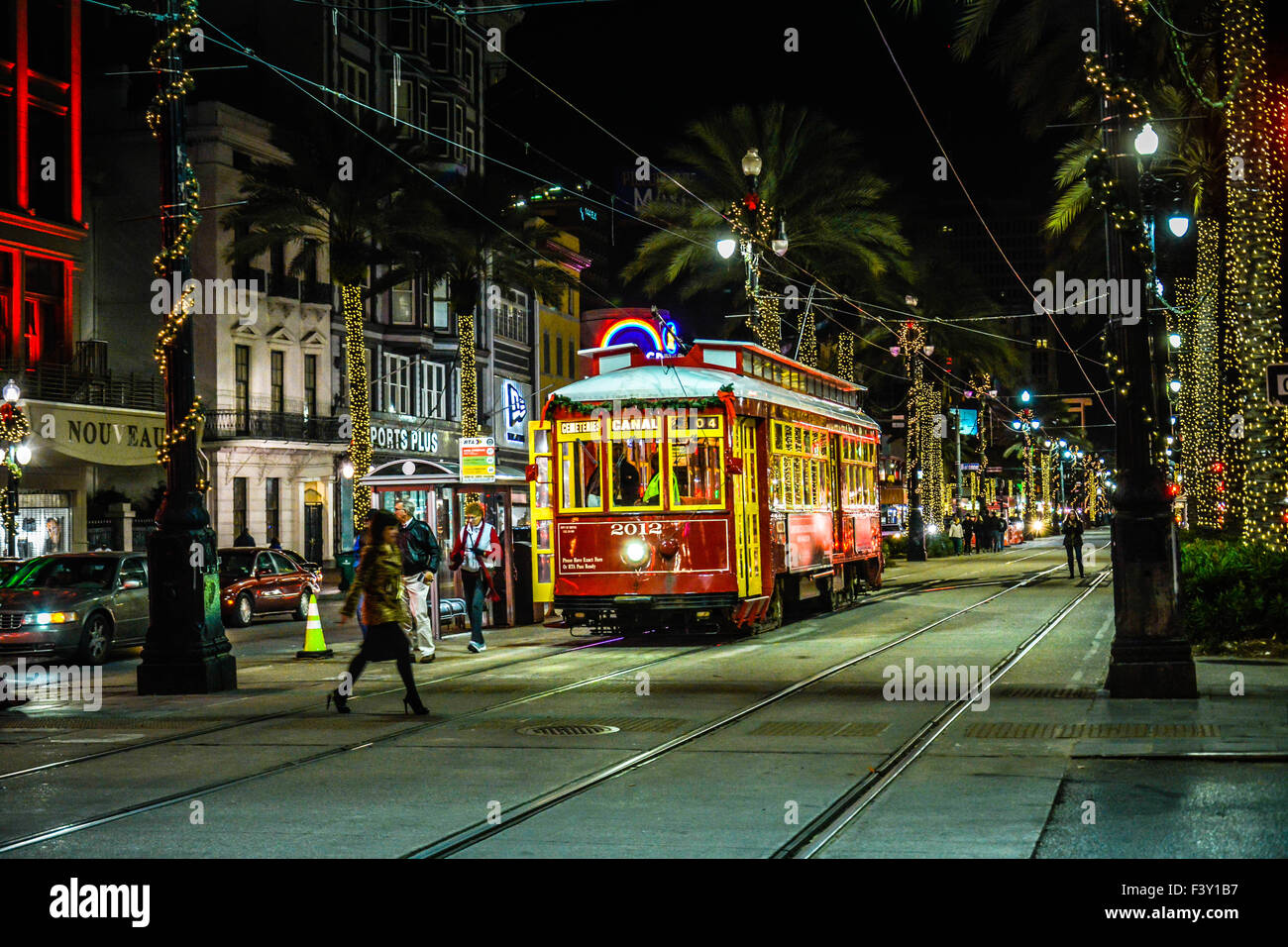 The Canal Streetcar at night among the neon lights and palm tree ...