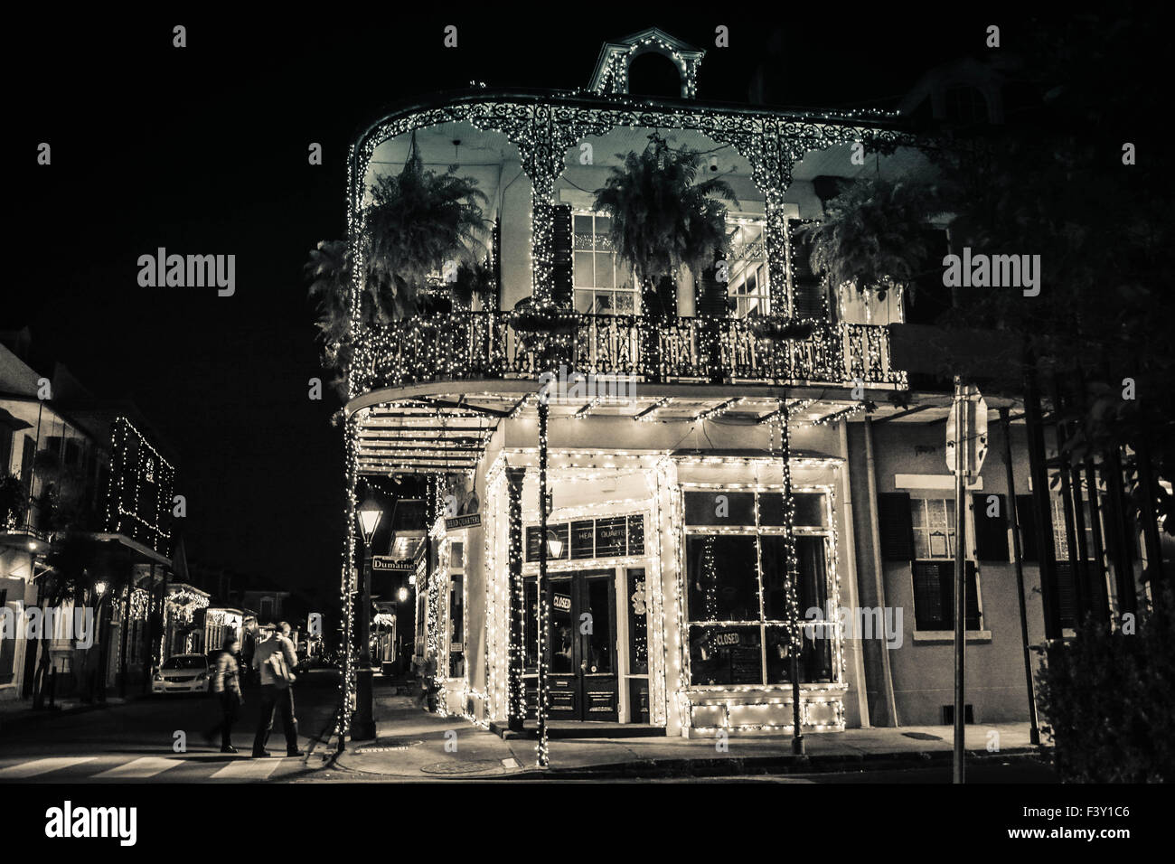 Elaborate string light decorations highlight a classic French Quarter ...
