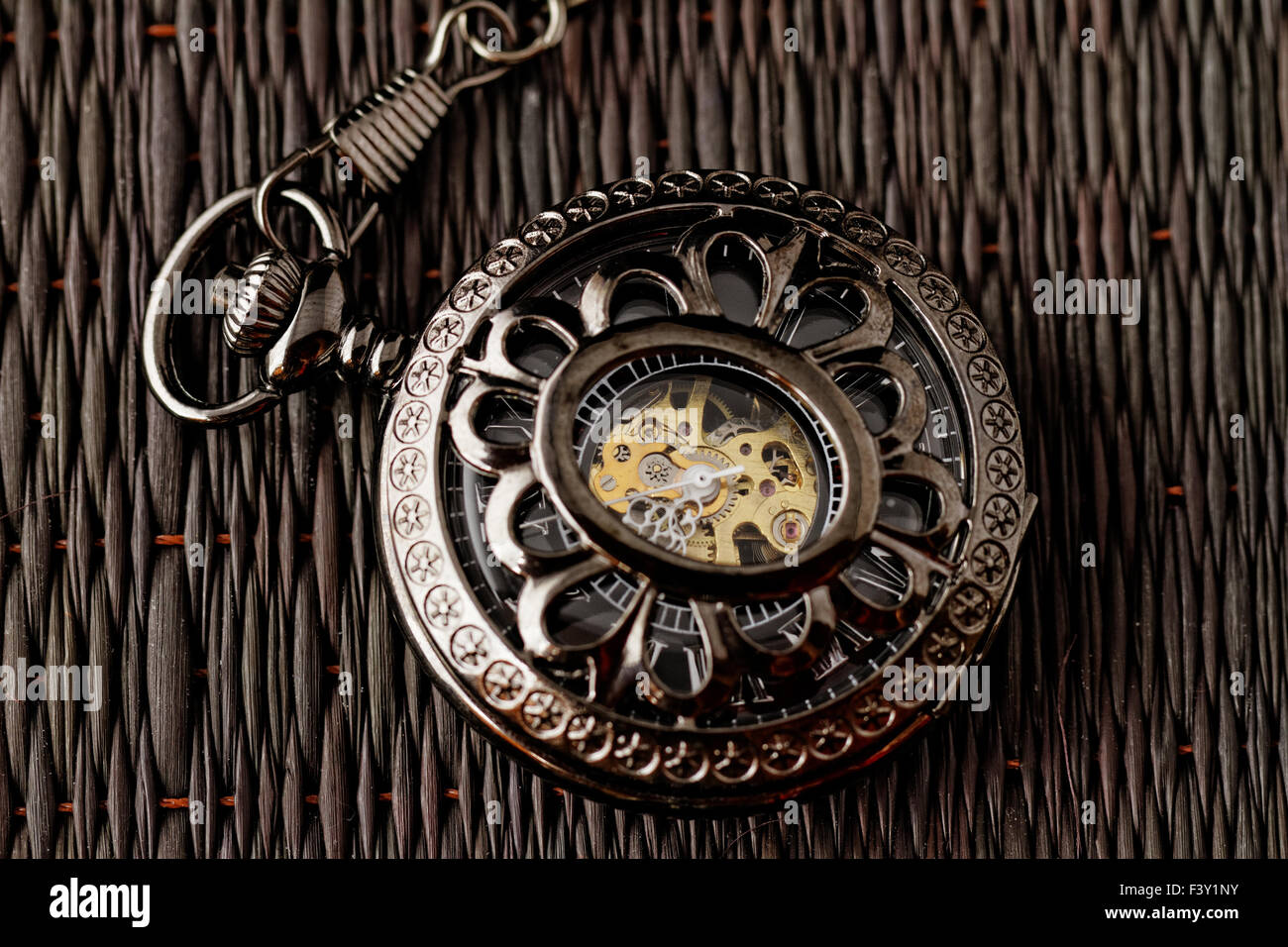 Old watch machine on dark background Stock Photo - Alamy
