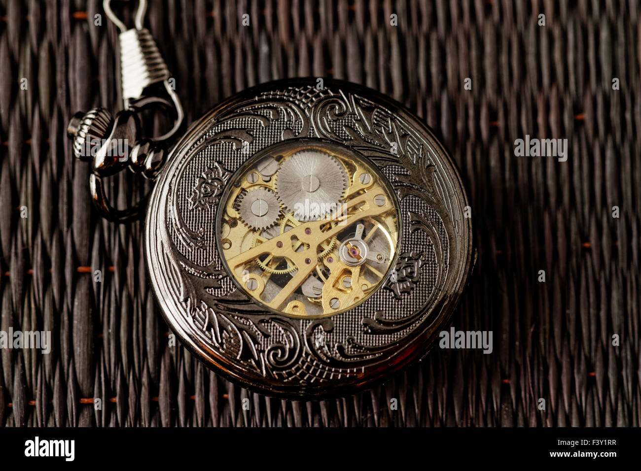 Old watch machine on dark background Stock Photo - Alamy