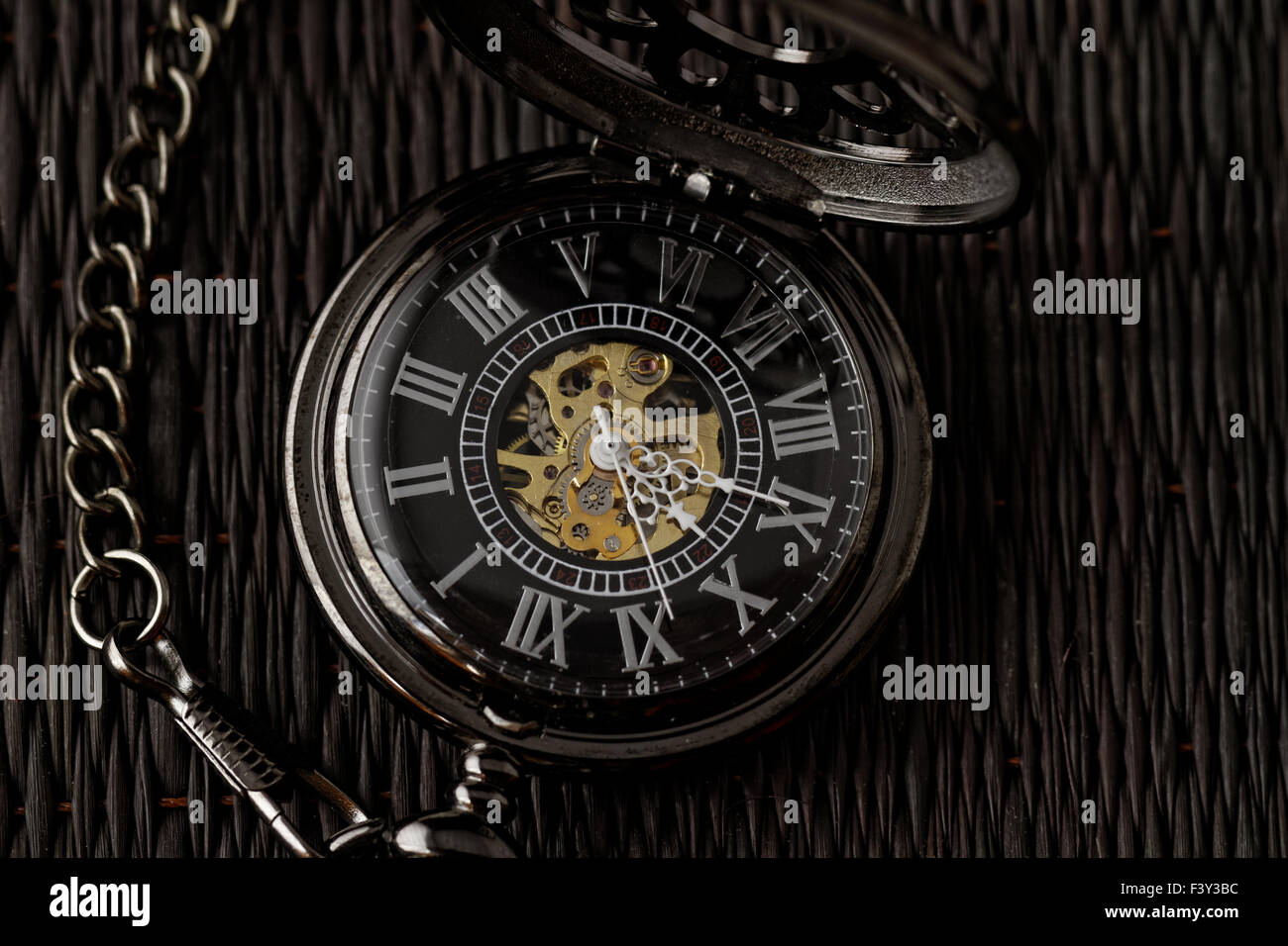 Old watch machine on dark background Stock Photo - Alamy