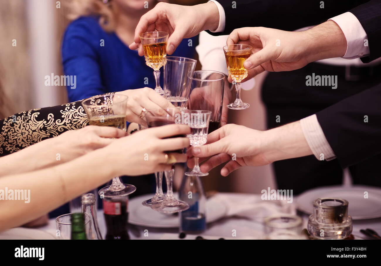 Group of people toasting at a celebration Stock Photo - Alamy
