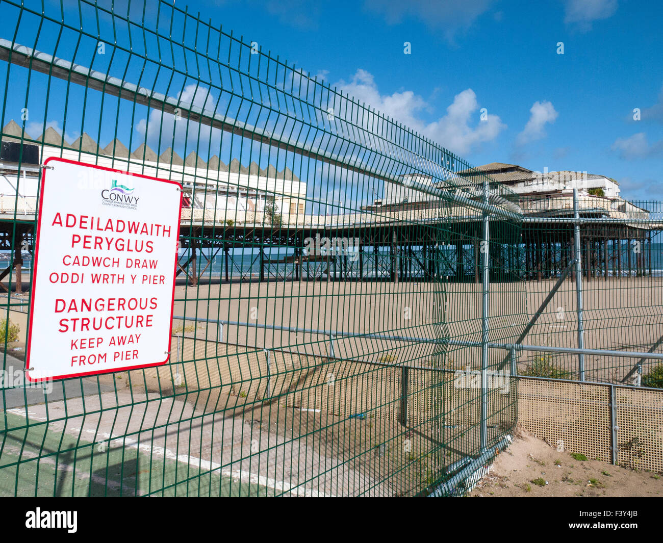 Warning sign for The Victorian Pier in Colwyn Bay Stock Photo - Alamy