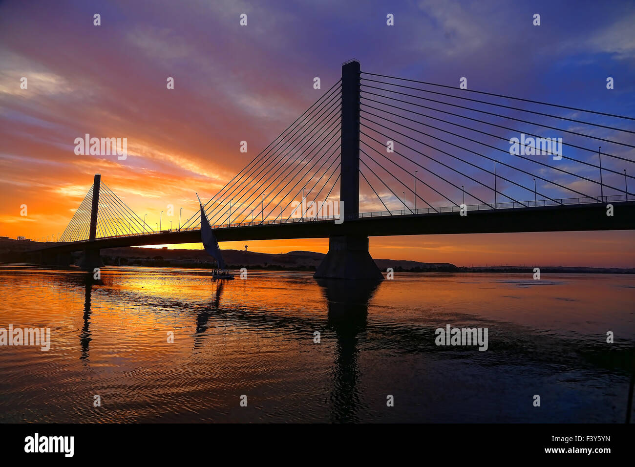 Bridge of Aswan with sailing Fulccas- Sunset shot Stock Photo - Alamy