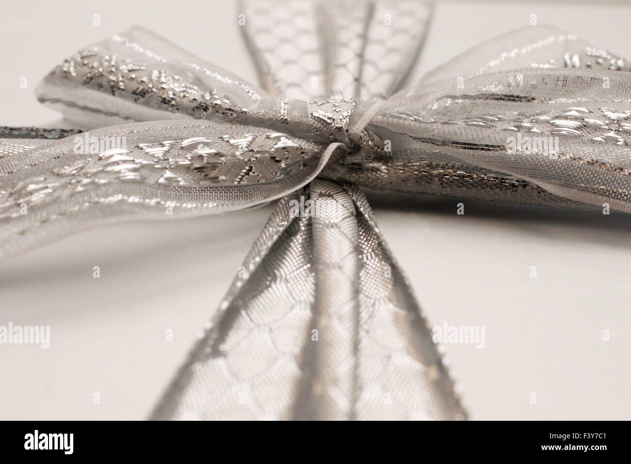 close-up picture of a silver present-ribbon Stock Photo - Alamy