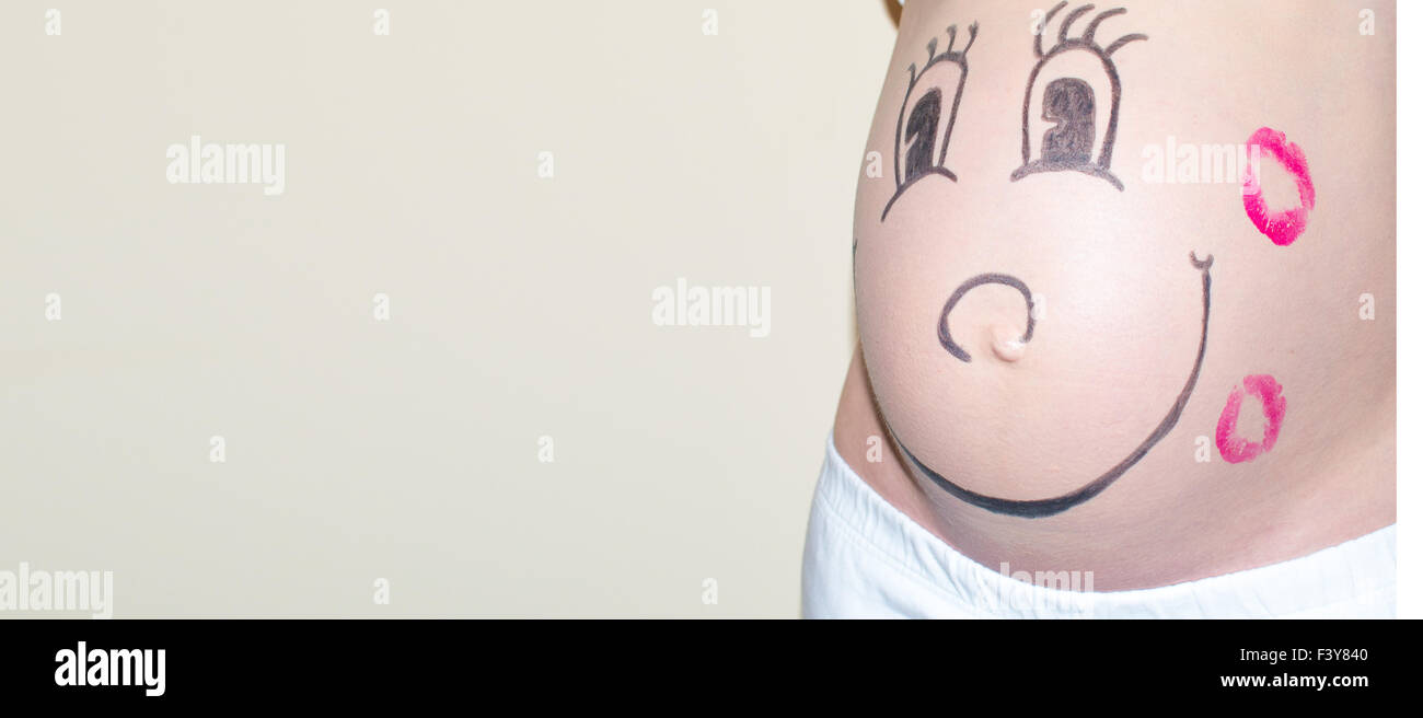 Belly pregnancy with big smile Stock Photo - Alamy