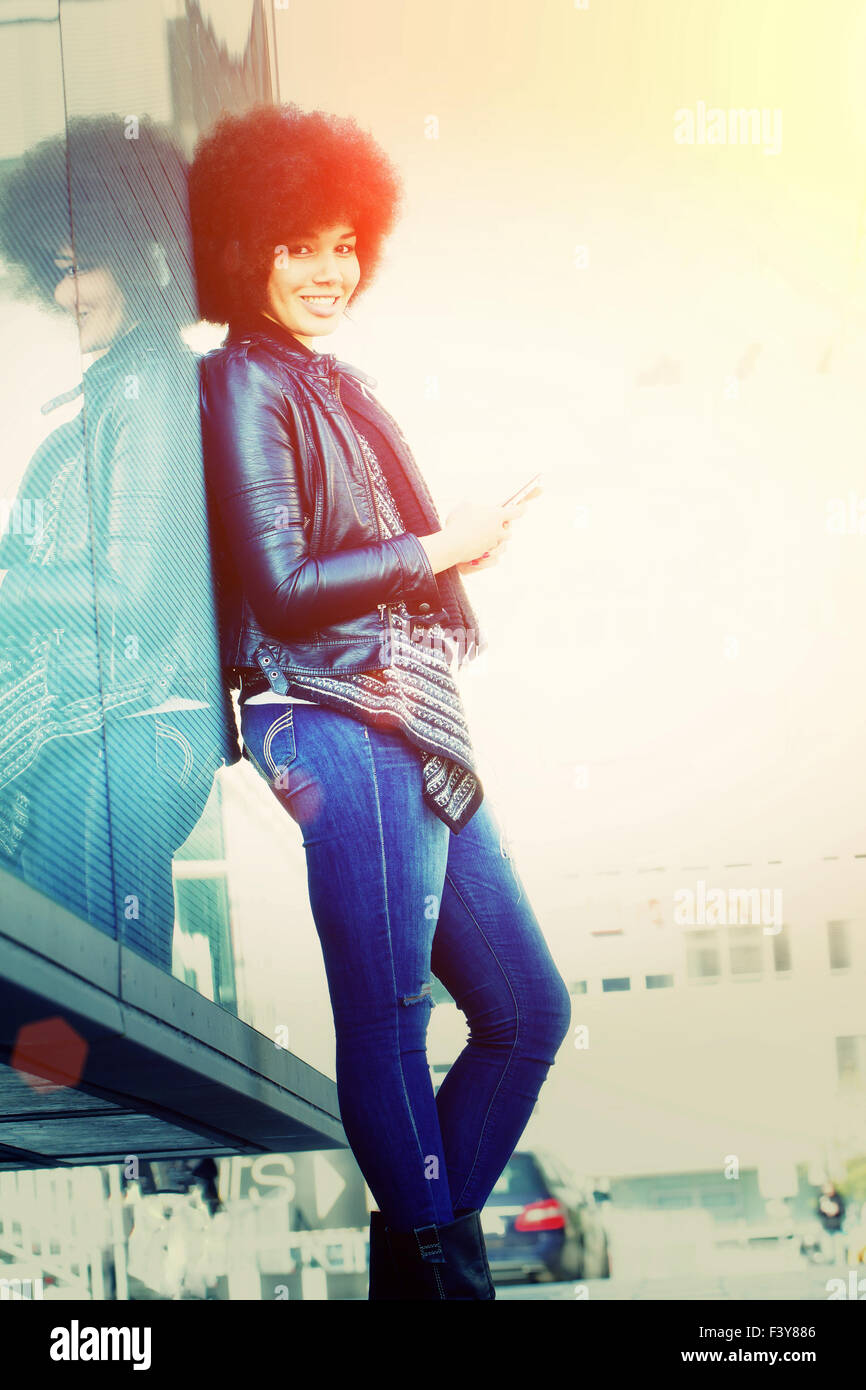 Young, black woman listen music in the sun Stock Photo - Alamy