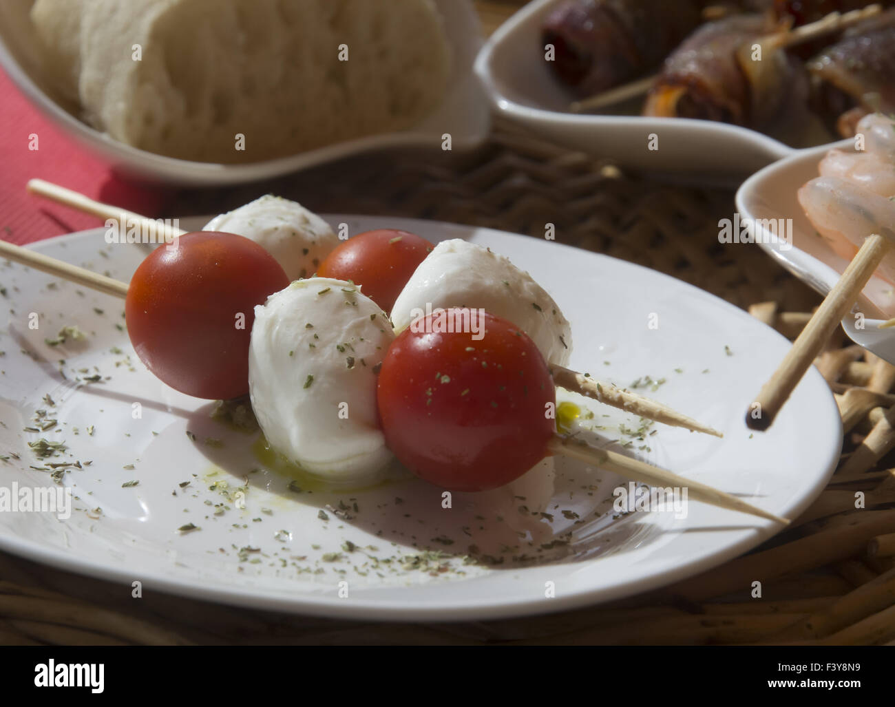 Tapas plate with tomatoes mozzarella cheese Stock Photo - Alamy