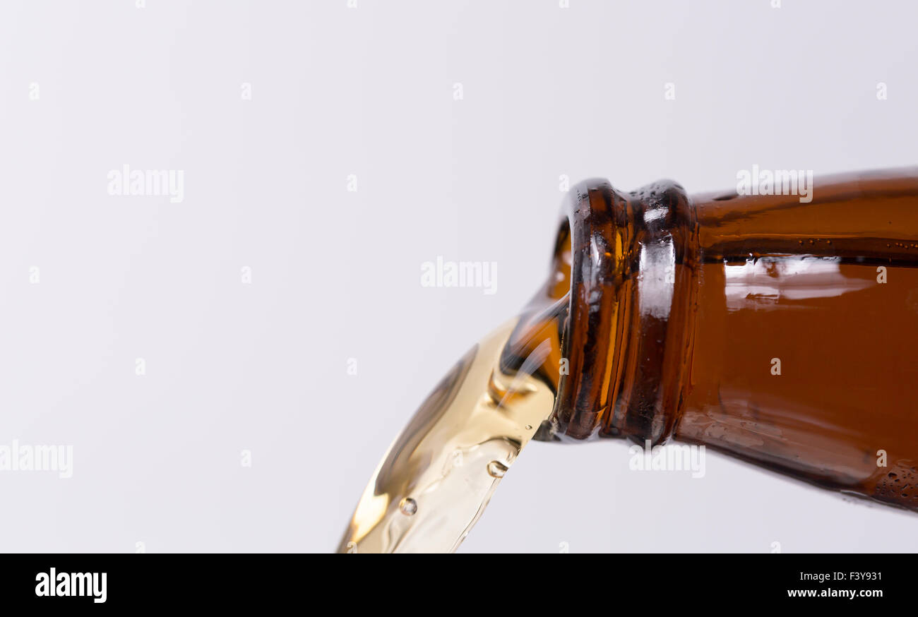 Beer Pouring From Bottle close up Stock Photo - Alamy