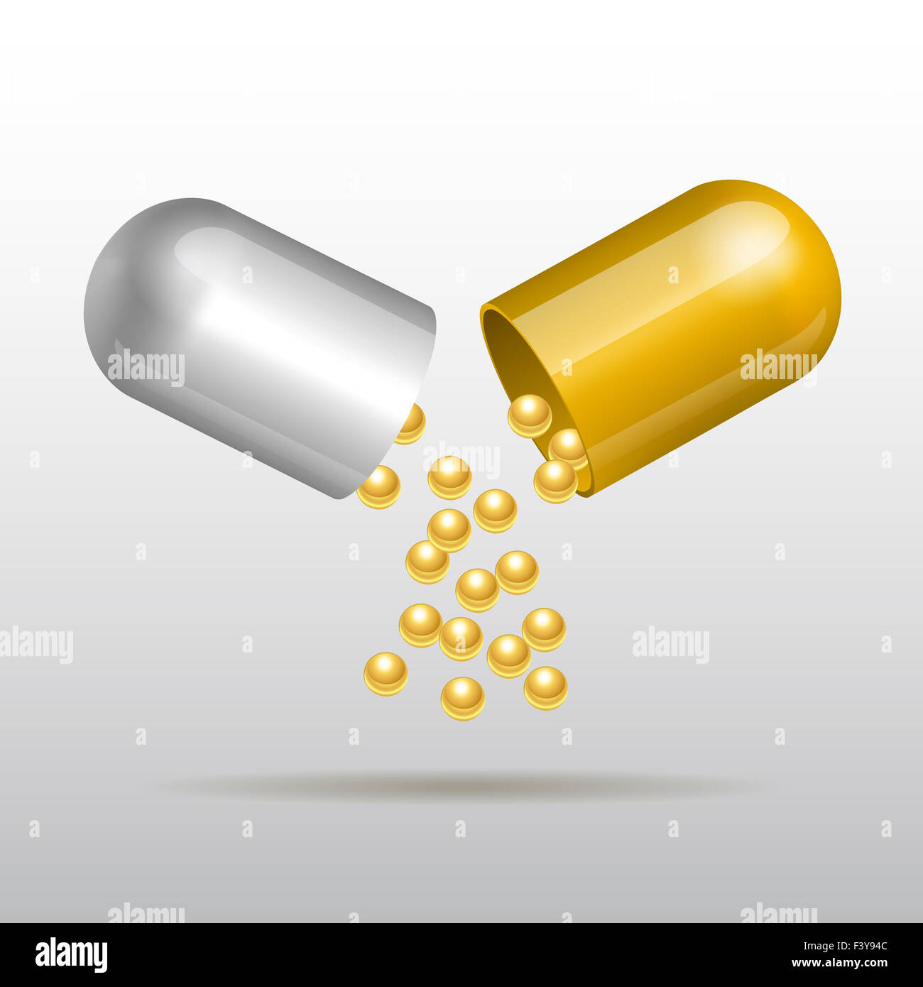 Opening gold medical capsule Stock Photo - Alamy