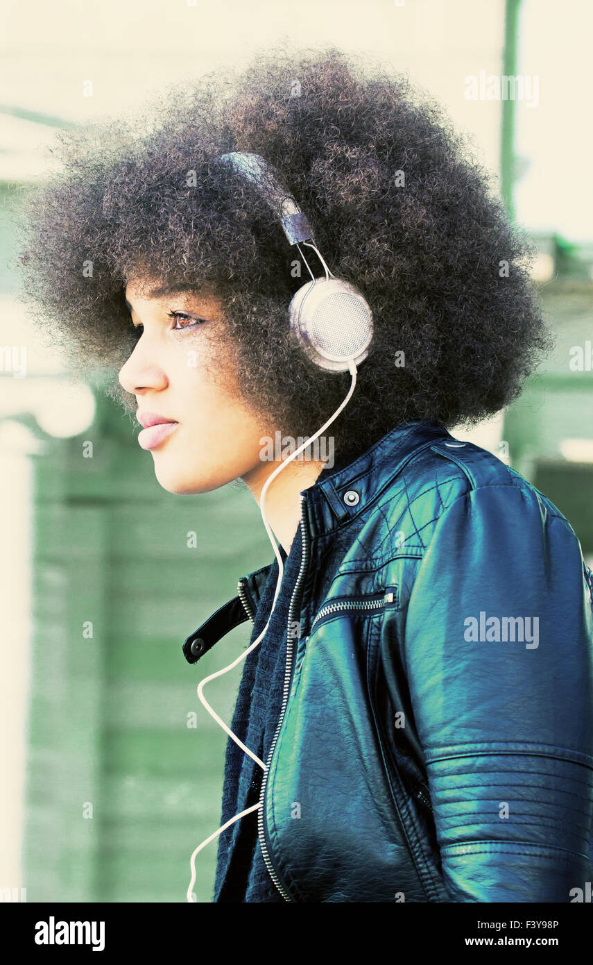 Young, black woman listen music Stock Photo - Alamy