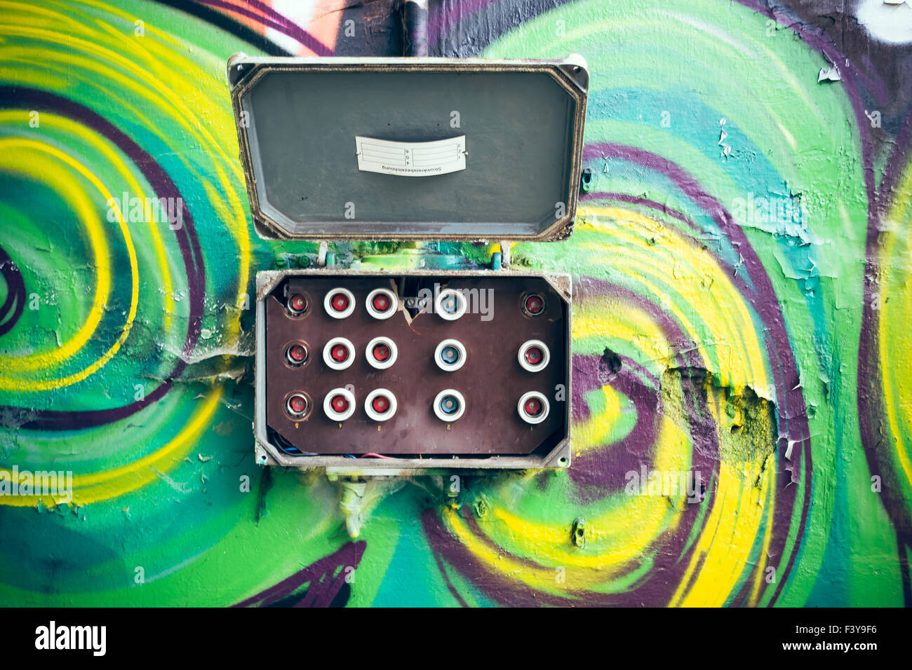 Colorful wall with fuse box Stock Photo - Alamy