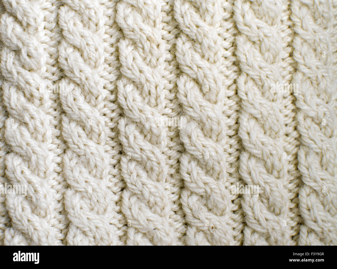 Creamy off-white wool knit work Stock Photo - Alamy