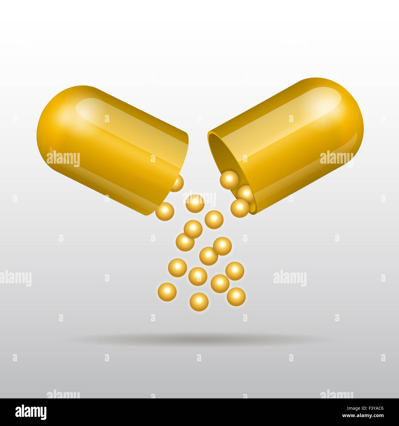 Opening gold medical capsule Stock Photo - Alamy