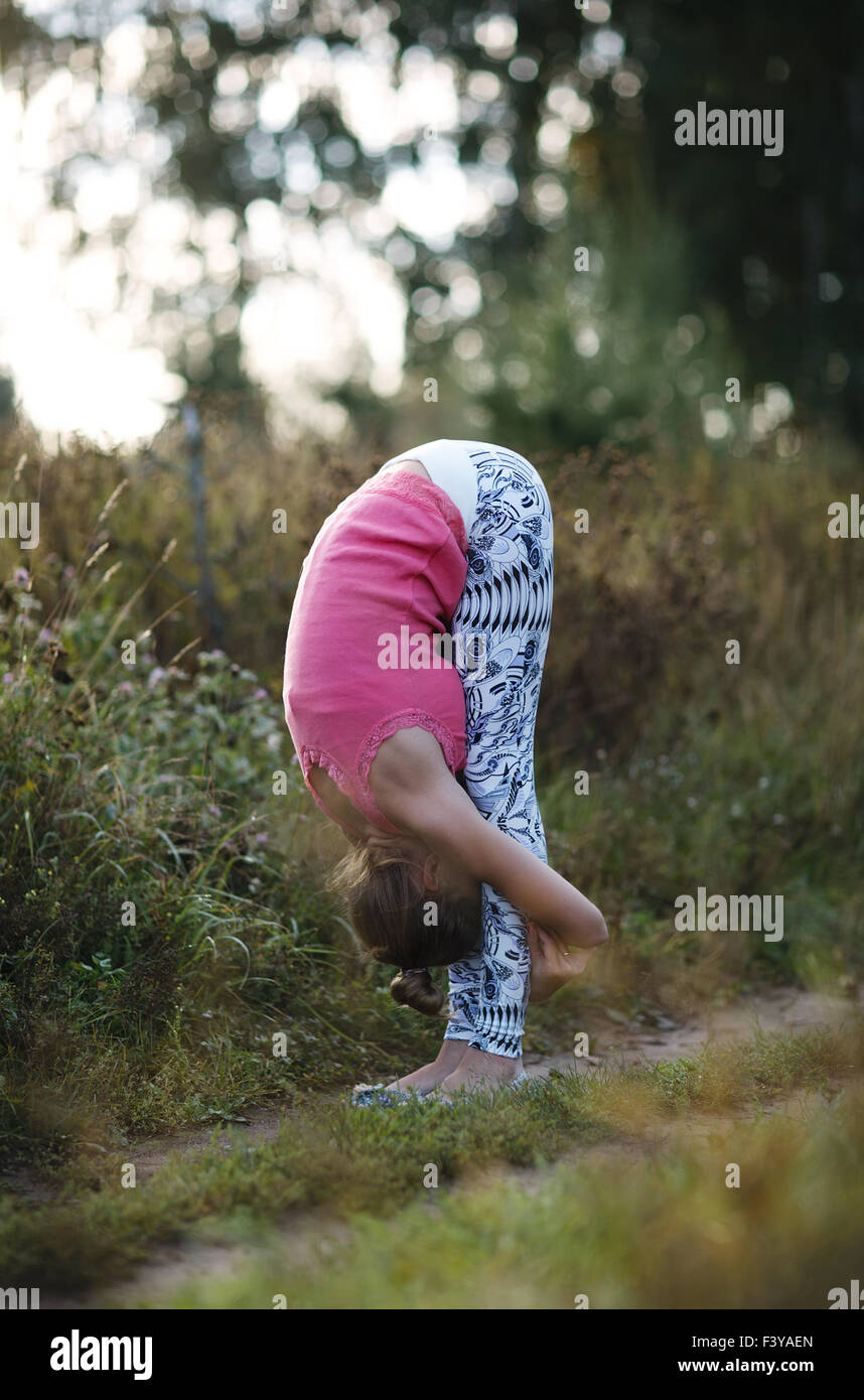 Supple young woman bending double Stock Photo - Alamy