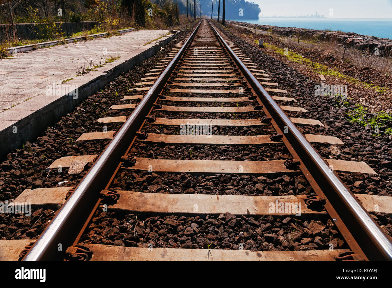 Railroad track near sea beach Stock Photo - Alamy