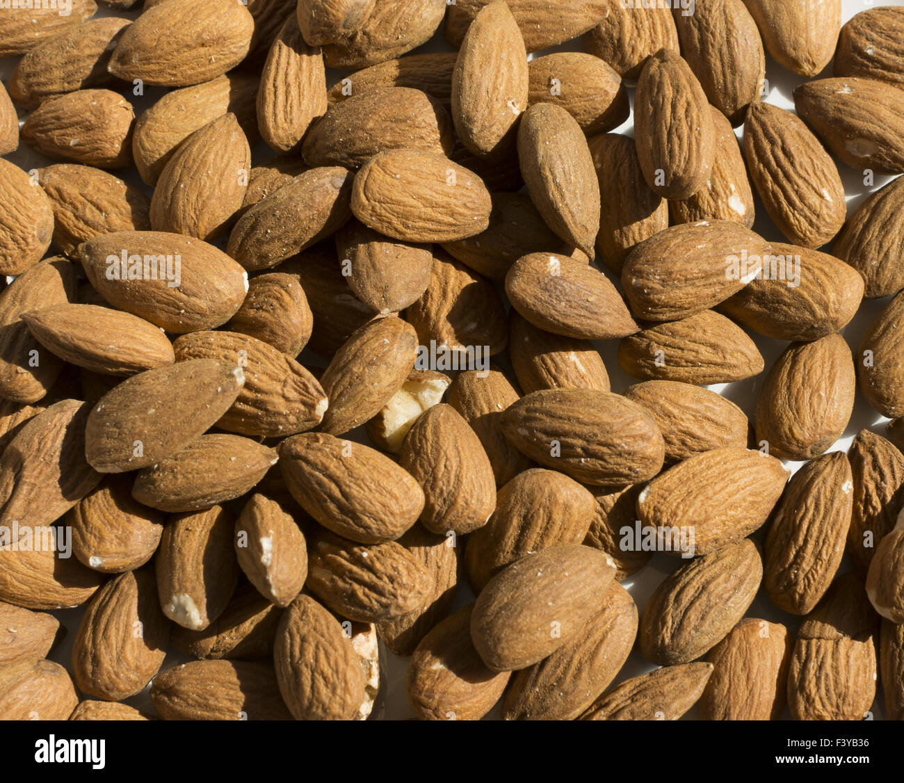 Raw almonds full frame Stock Photo - Alamy