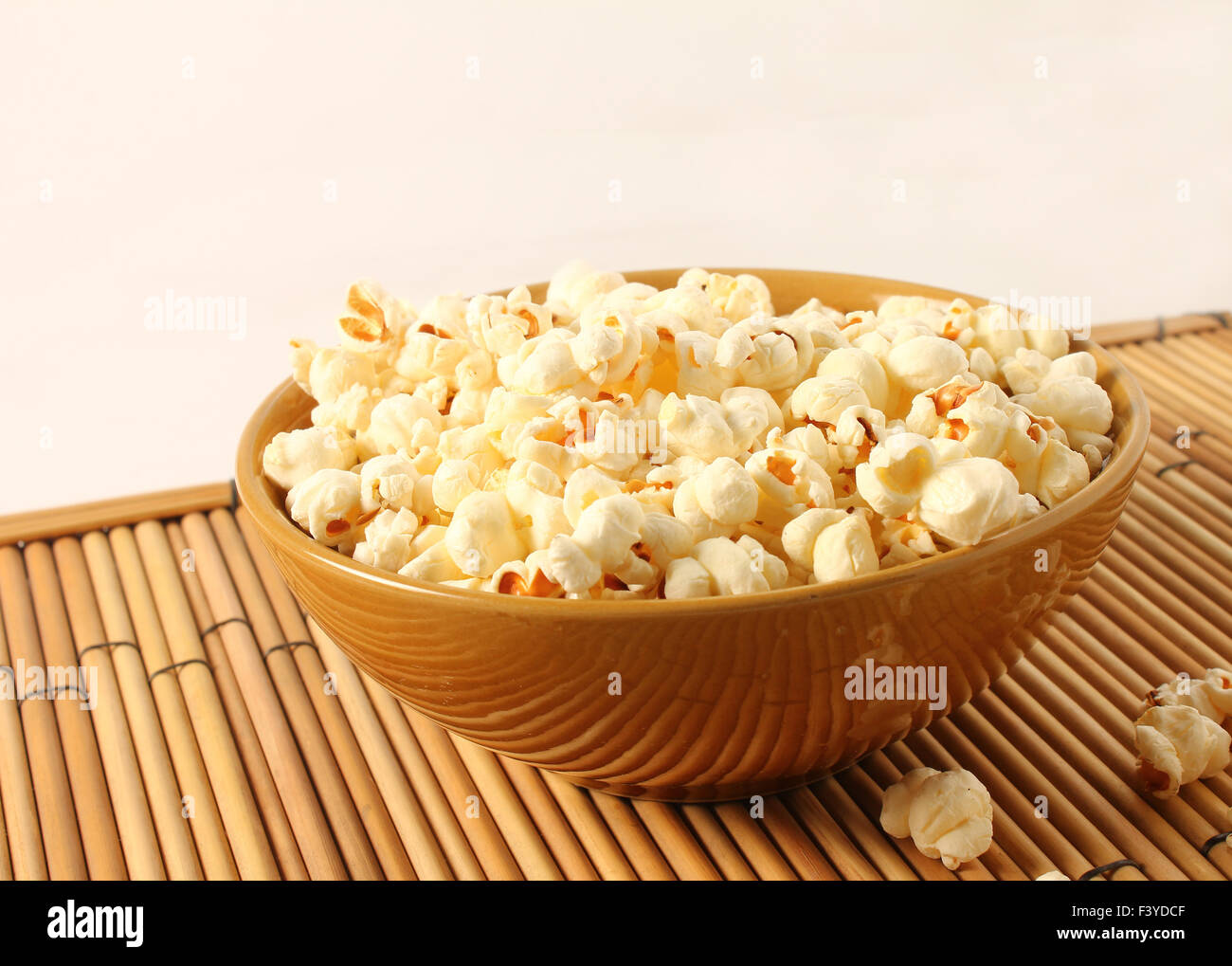 popcorn in bowl isolated in white background Stock Photo - Alamy