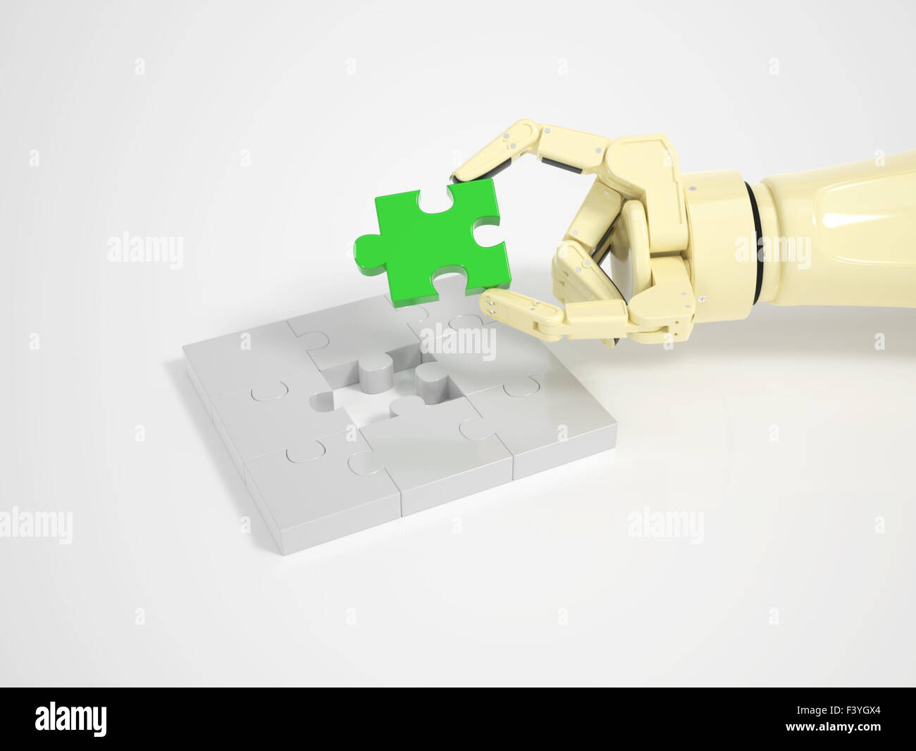 Robot completes jigsaw puzzle game Stock Photo - Alamy