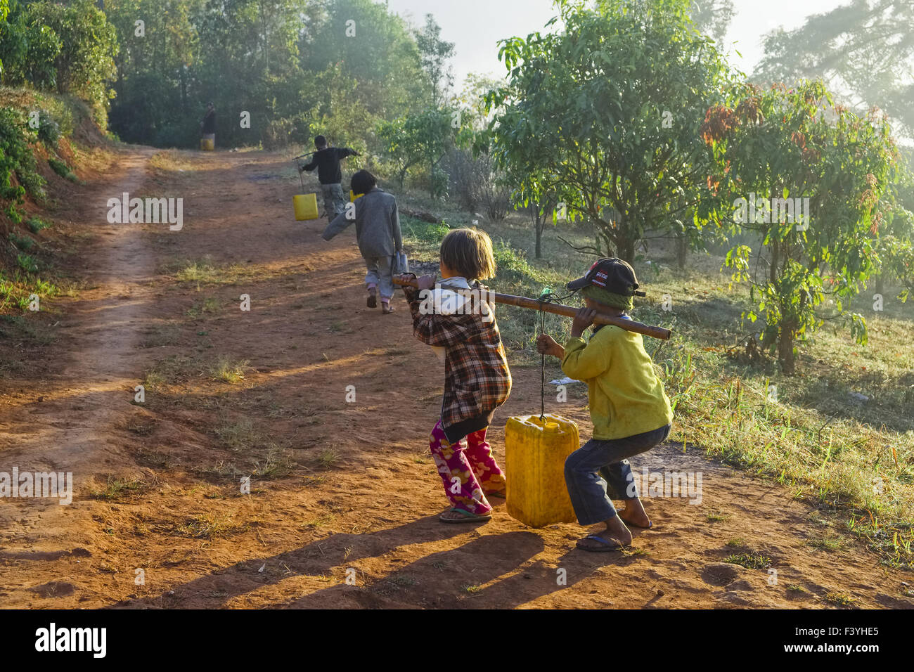 Children fetching water hi-res stock photography and images - Alamy