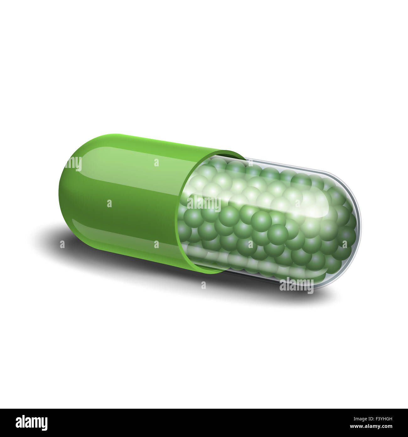 Medical green capsule with granules Stock Photo - Alamy