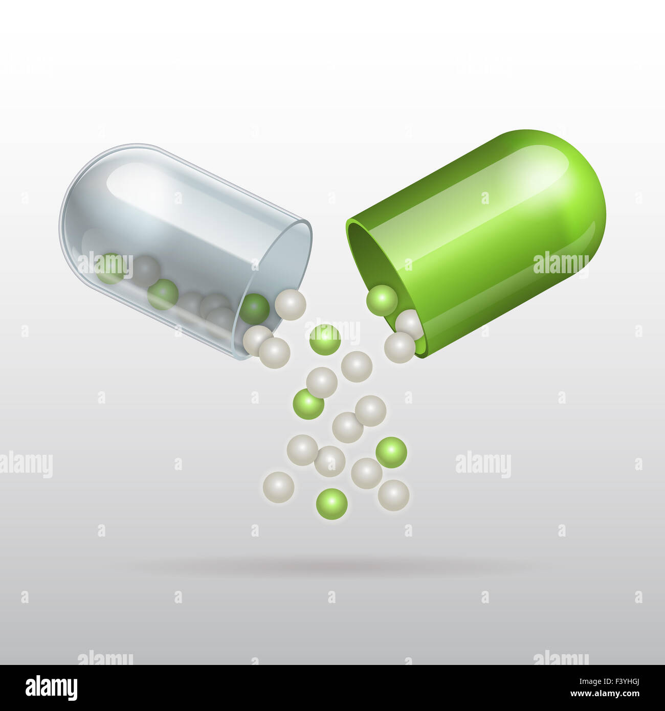 Opening Medical green capsule Stock Photo - Alamy
