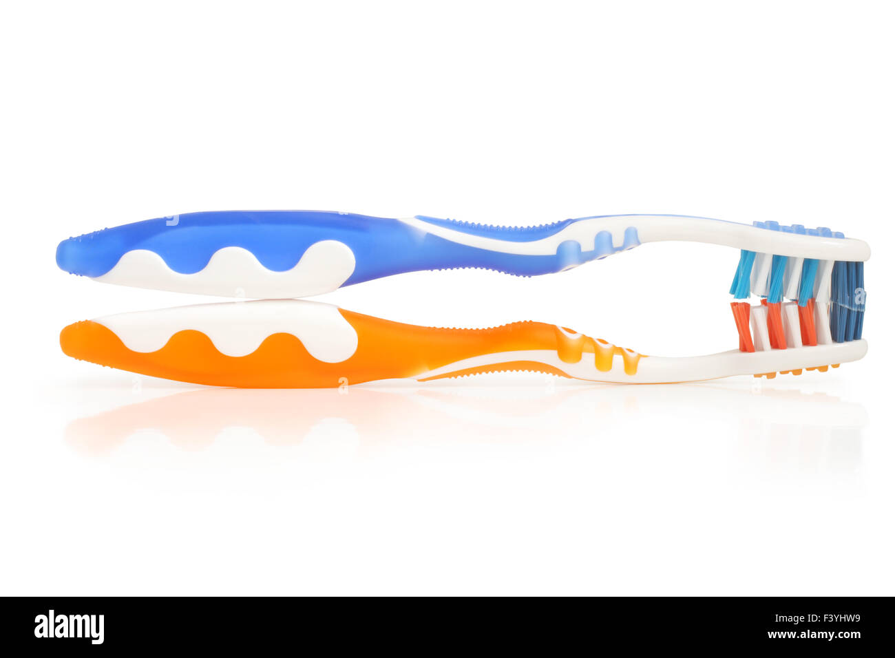 Two tooth brushes red and blue hi-res stock photography and images - Alamy