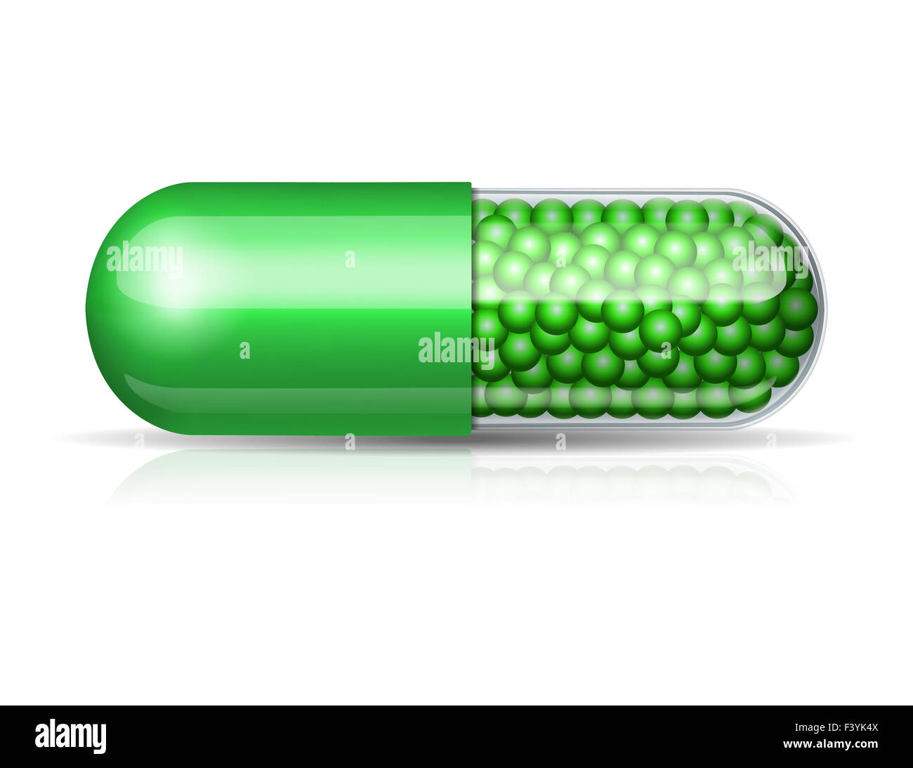 Medical green capsule with granules Stock Photo - Alamy