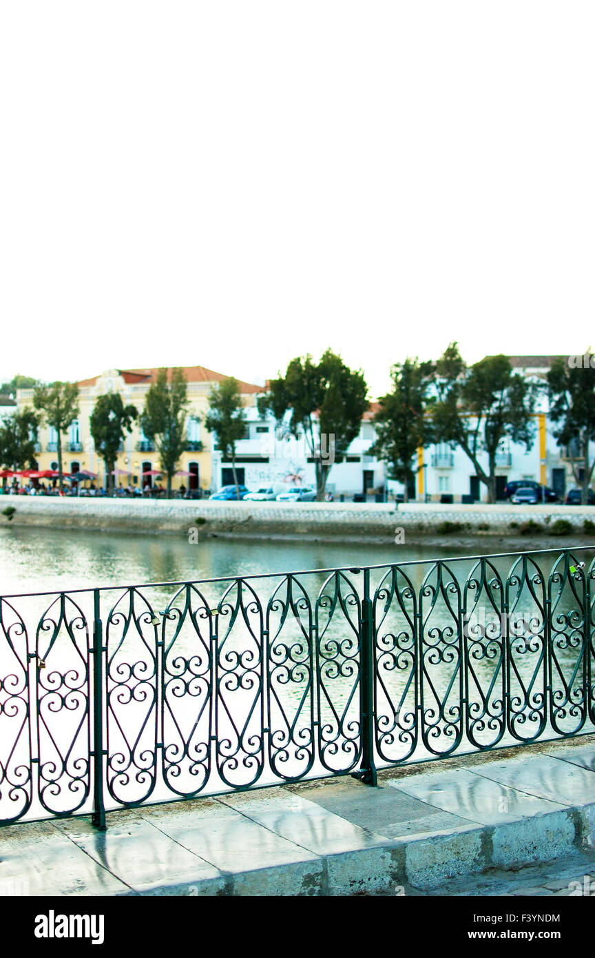 View of a bridge railing and historic town in background Stock Photo ...