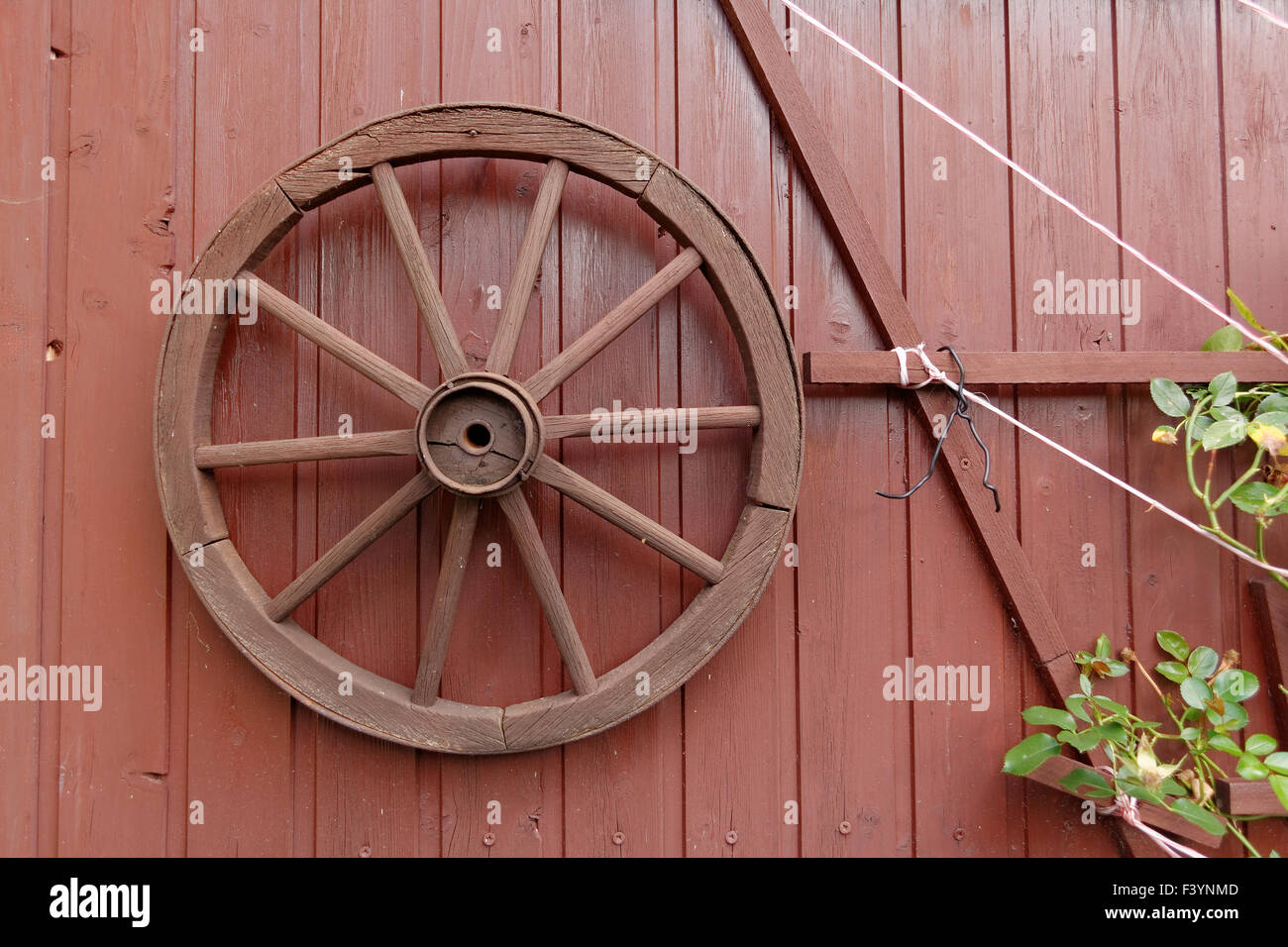 Wooden wheel decoration Stock Photo - Alamy