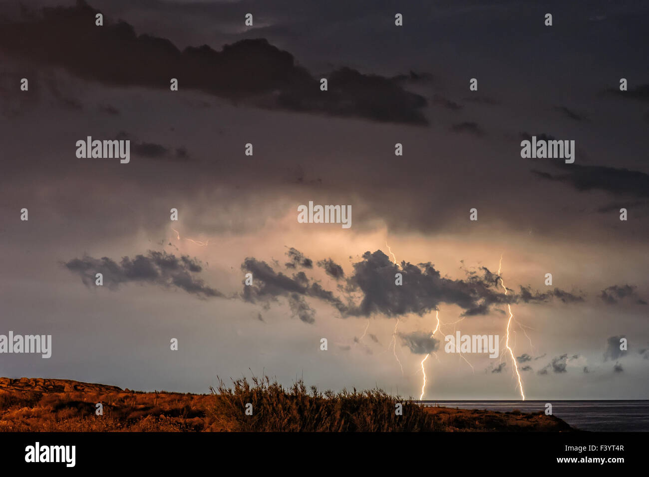 Lightning over sea Stock Photo - Alamy