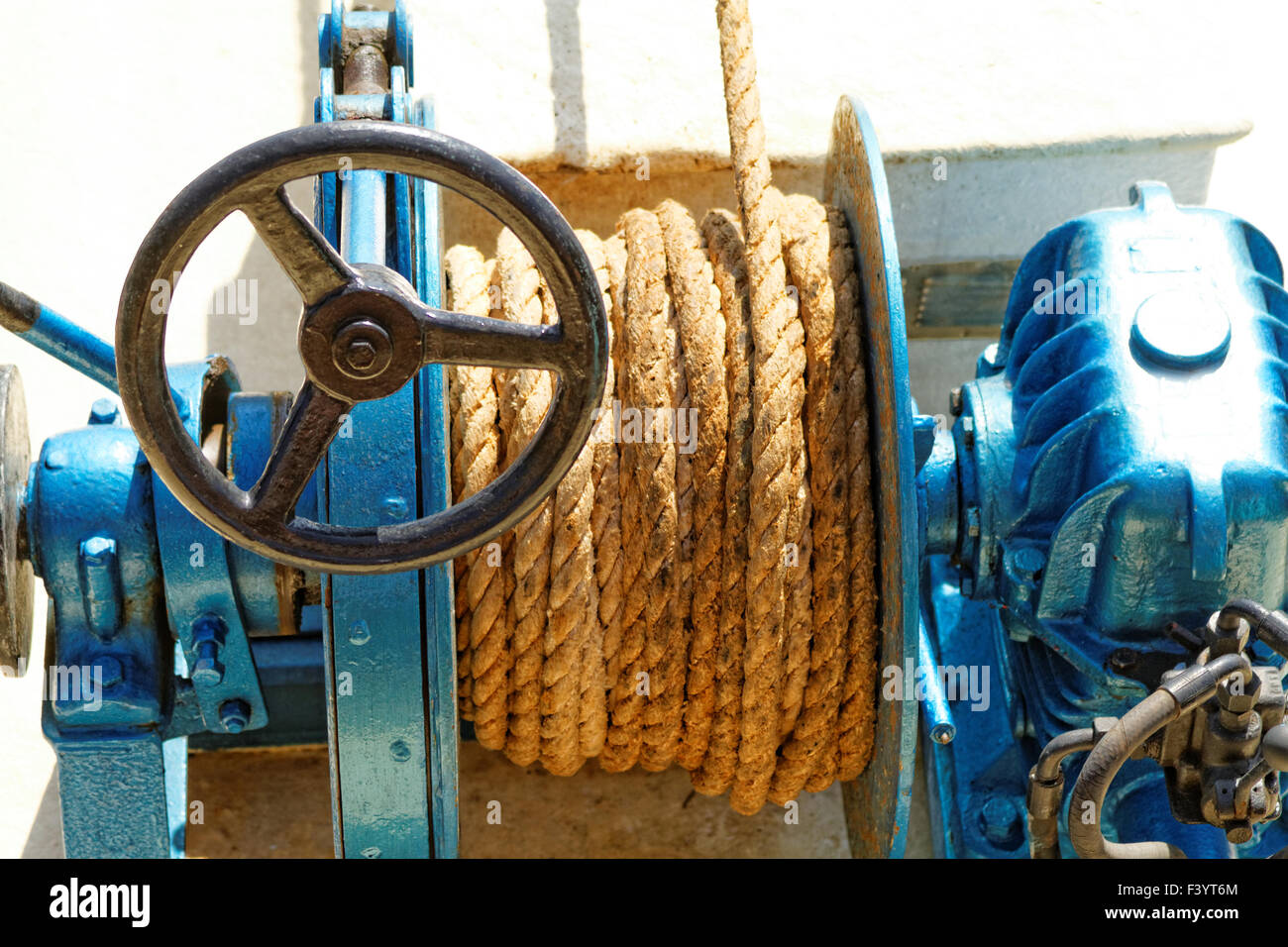 Photo of a ship's blue anchor motor winding Stock Photo - Alamy