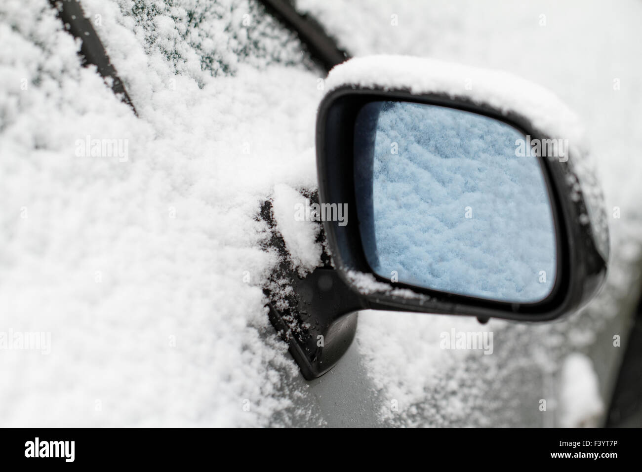 Photo of a snowy rearview mirror at winter Stock Photo - Alamy