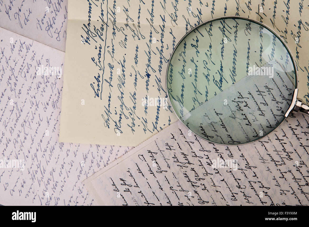 magnifying glass and letters Stock Photo - Alamy