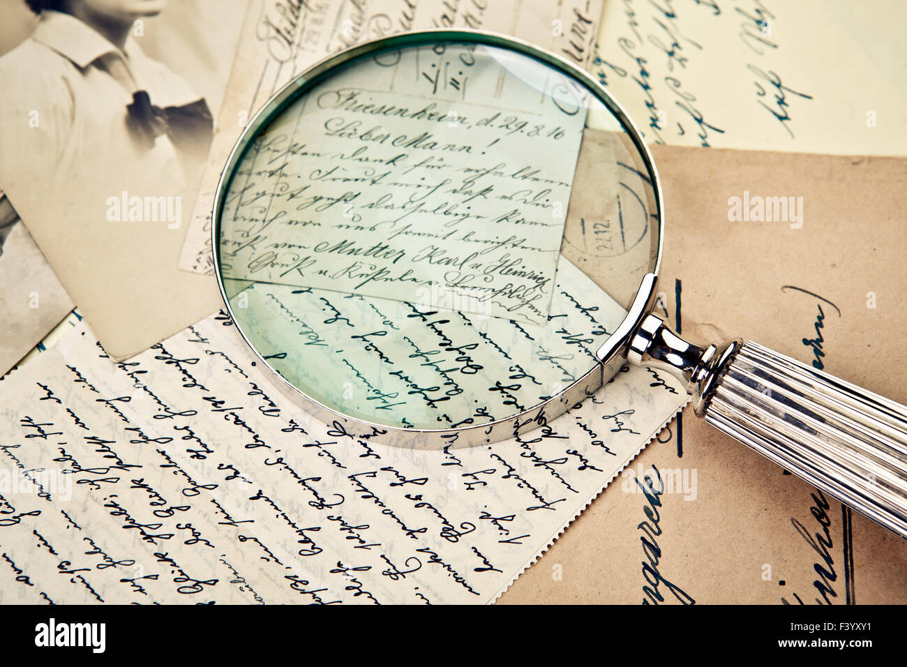magnifying glass and letters Stock Photo - Alamy