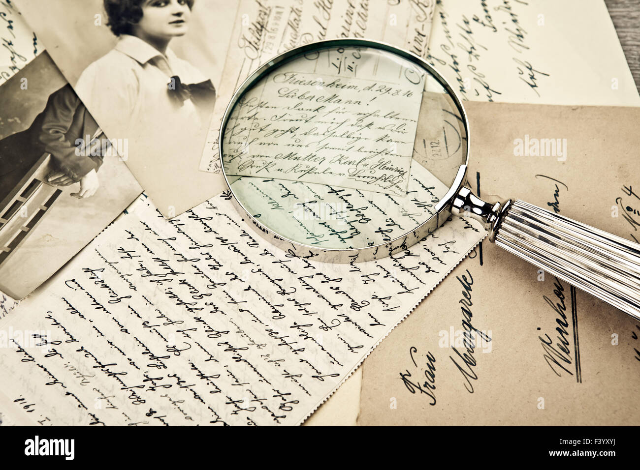 magnifying glass and letters Stock Photo - Alamy