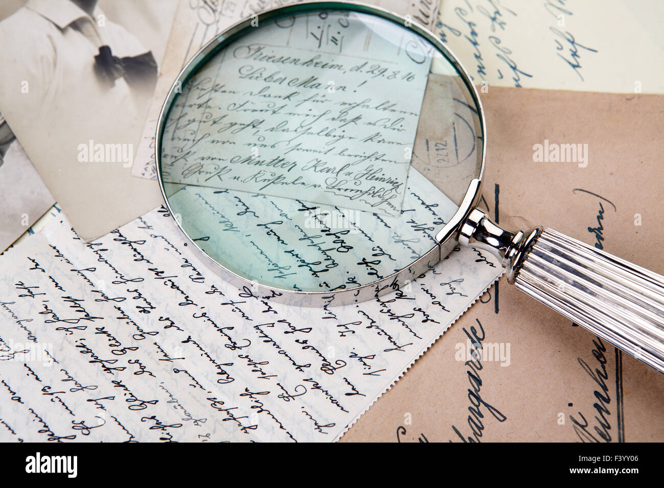magnifying glass and letters Stock Photo - Alamy