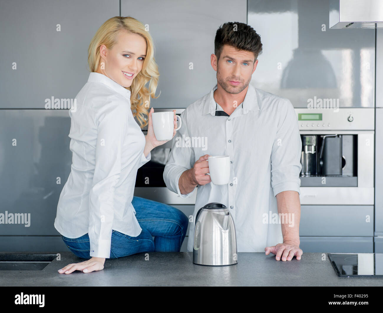 Couple enjoying a pot of freshly brewed coffee Stock Photo - Alamy