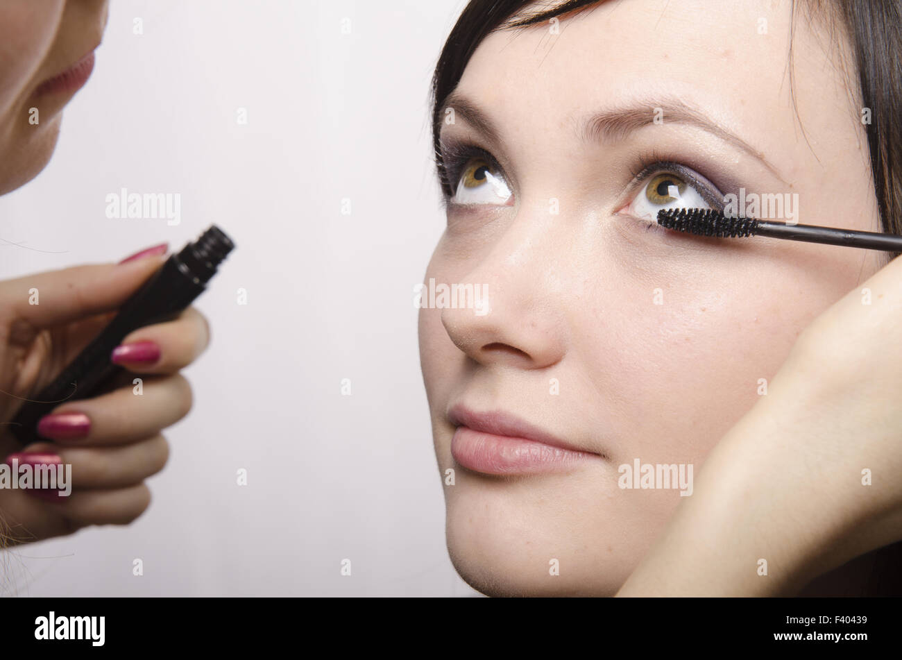 Makeup artist colors eyelashes model Stock Photo - Alamy