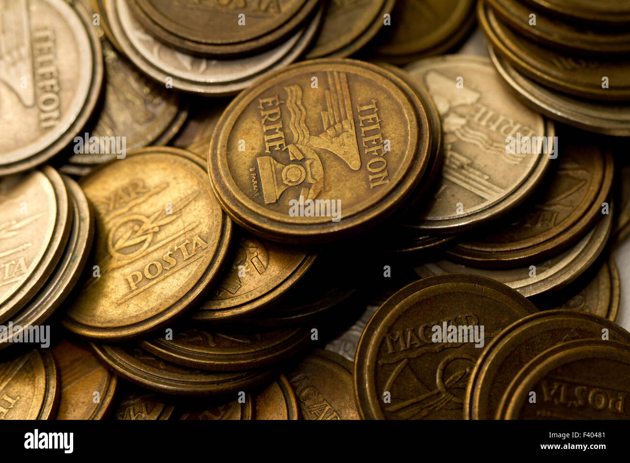 Close up photo of old telephone coin Stock Photo - Alamy