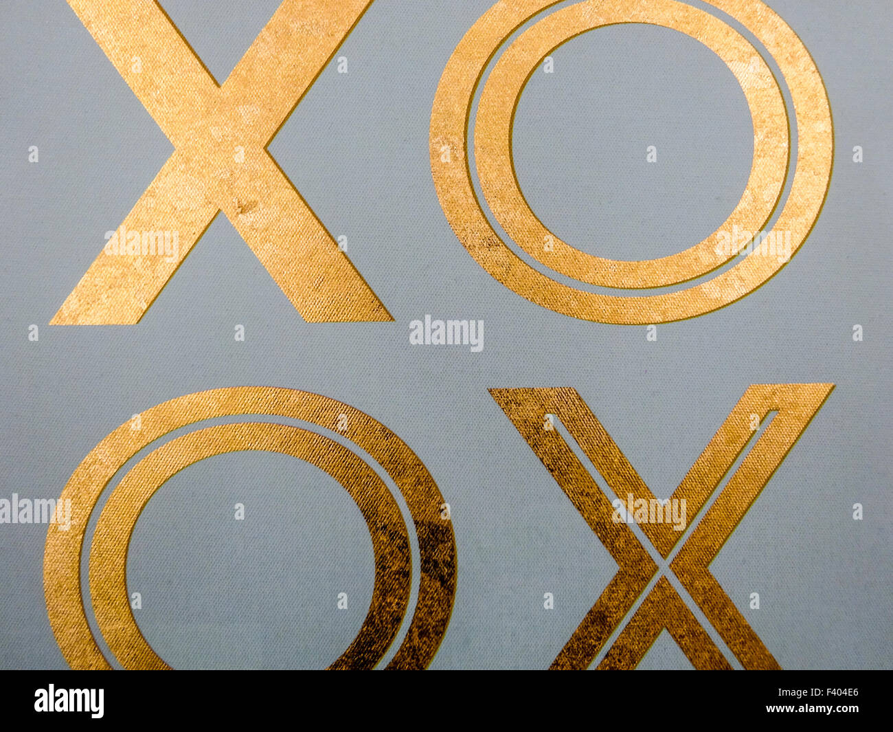 golden xoxo letters on canvas board Stock Photo - Alamy