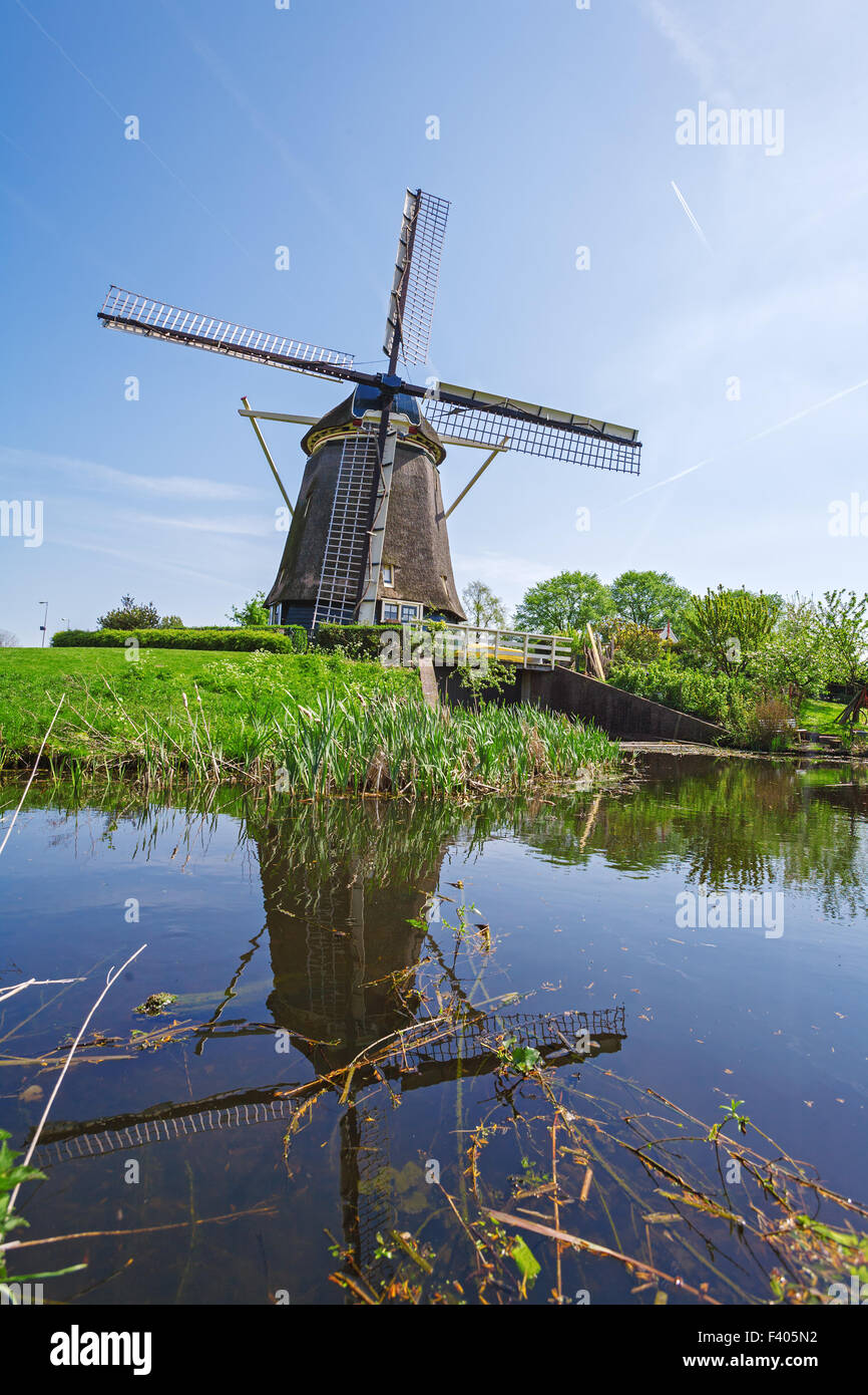 Vintage Windmill near Lake Stock Photo - Alamy