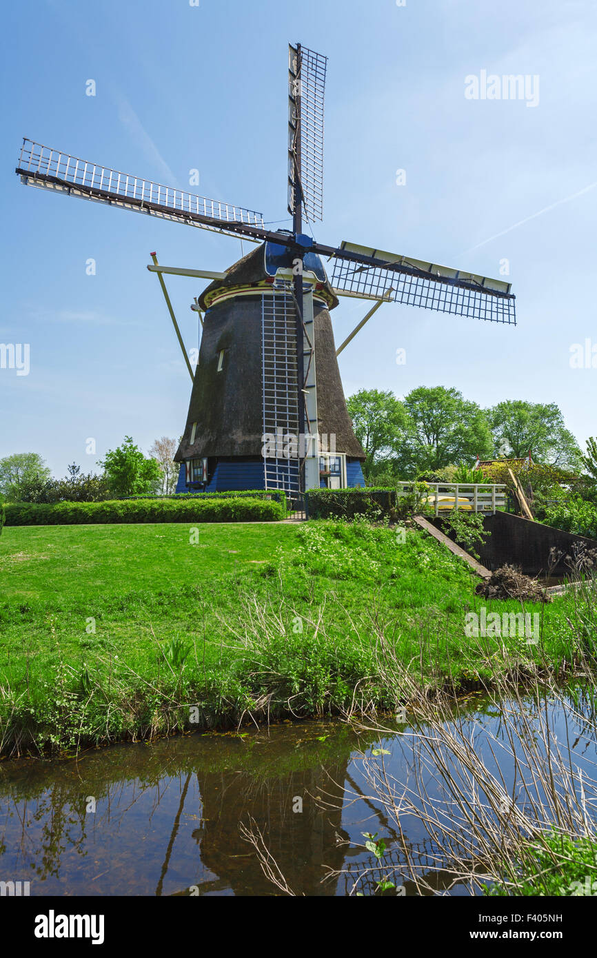 Vintage Windmill near Lake Stock Photo - Alamy