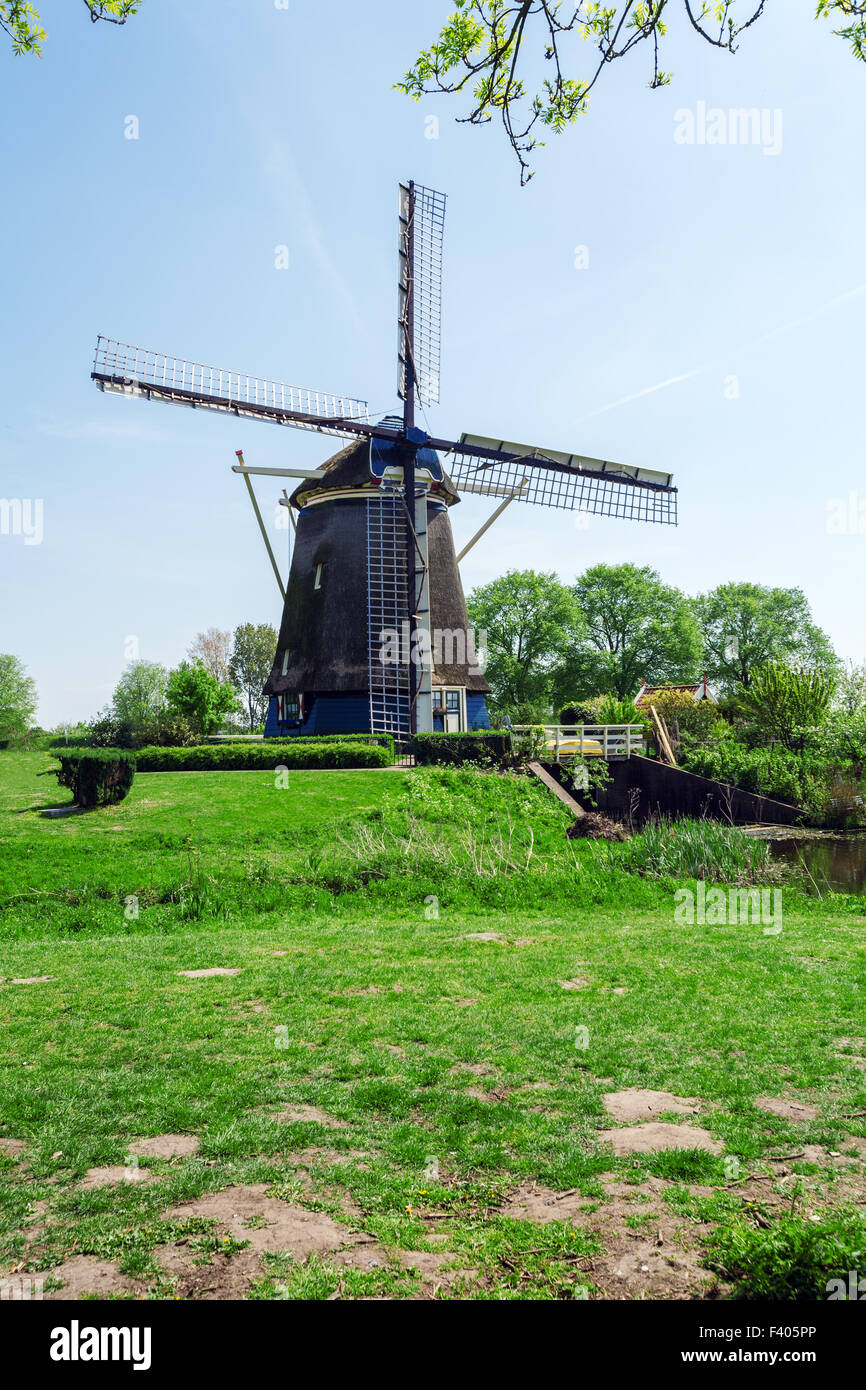Vintage Windmill near Lake Stock Photo - Alamy