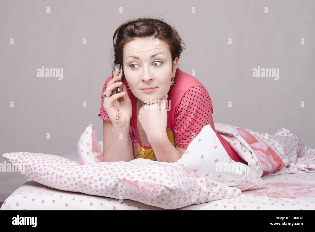 girl in shock from talking phone Stock Photo - Alamy