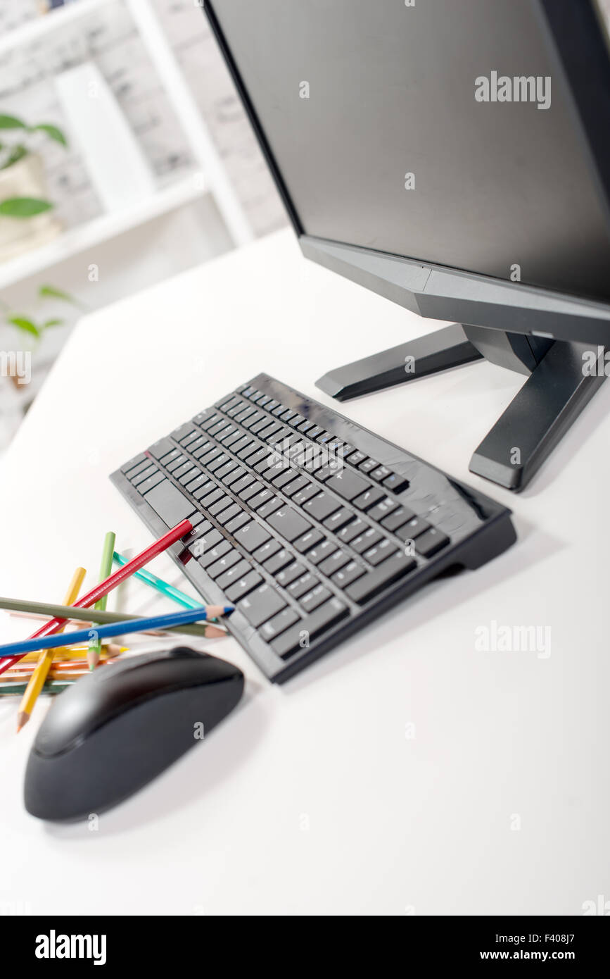 a computer with keyboard, mouse, and pencils Stock Photo - Alamy