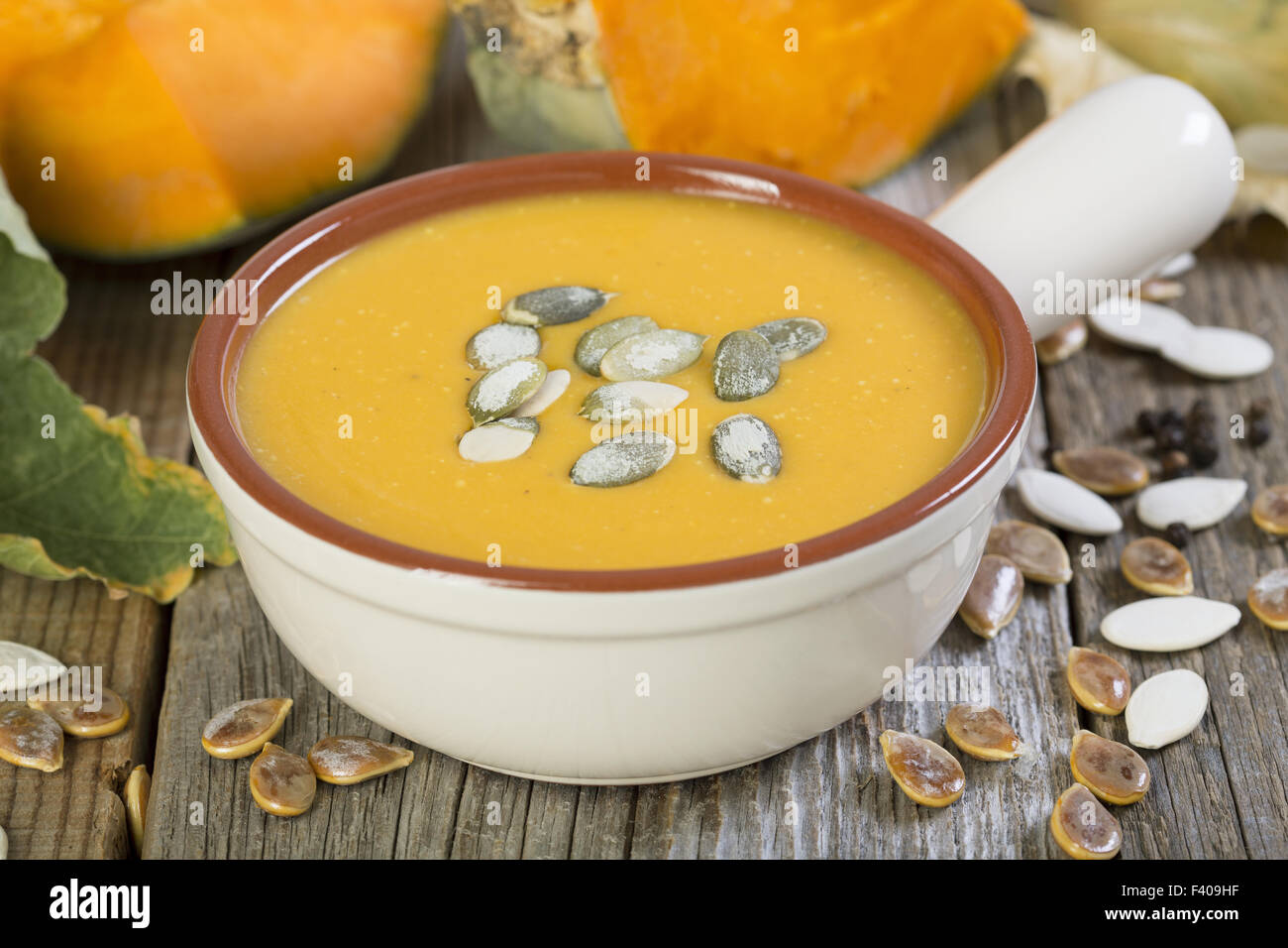 Pumpkin soup with seeds closeup Stock Photo - Alamy