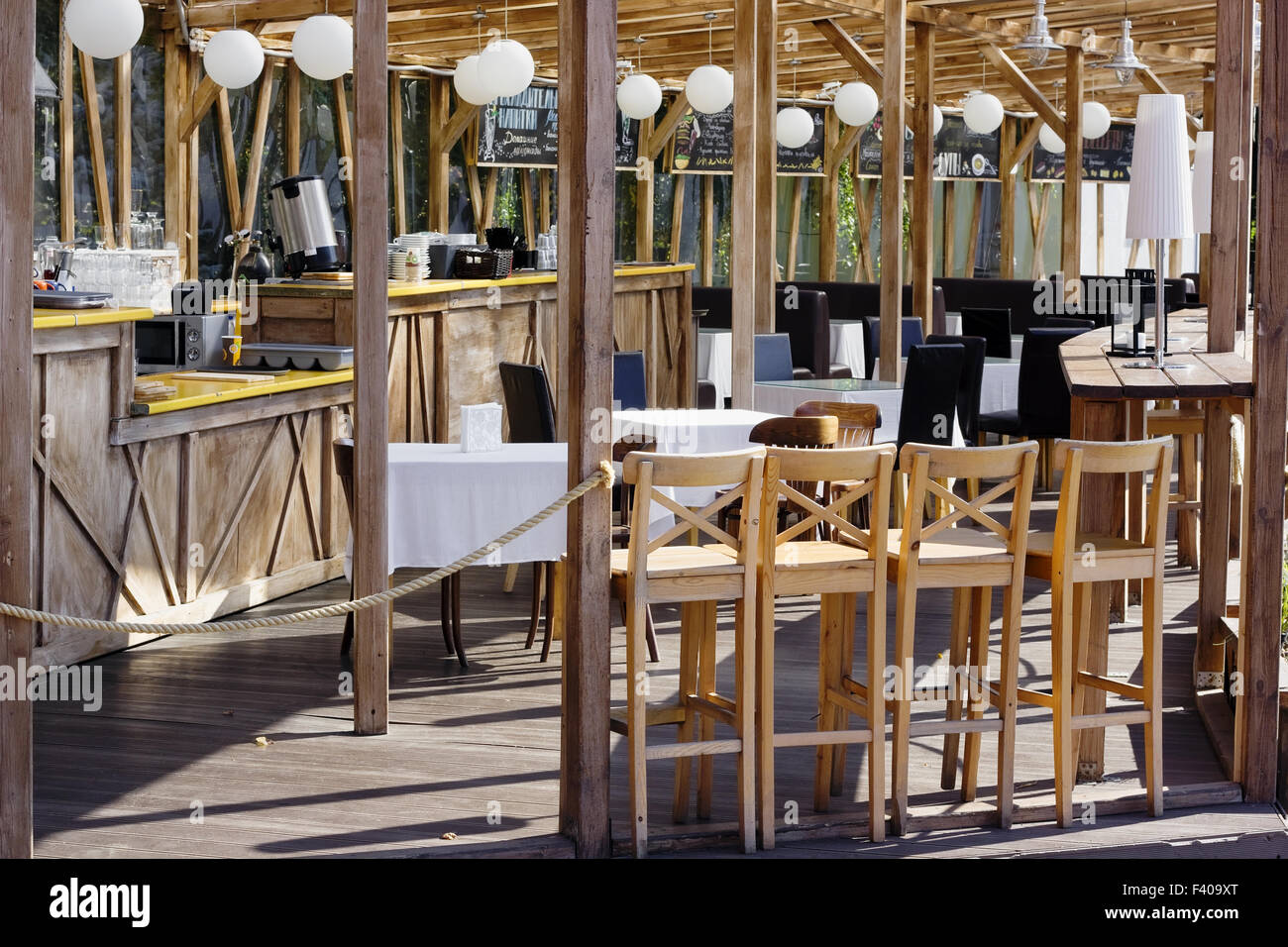 Wooden street cafe Stock Photo - Alamy