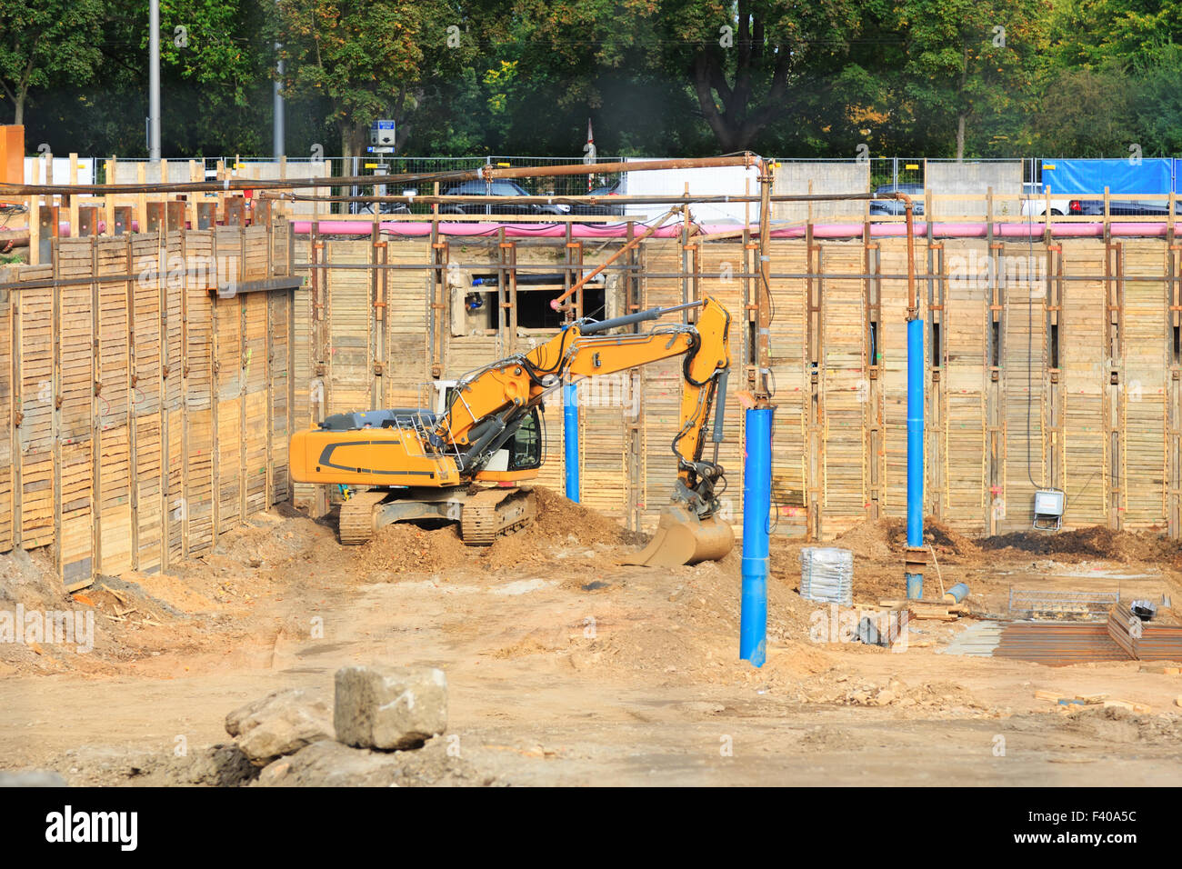 Excavator on the building site Stock Photo - Alamy