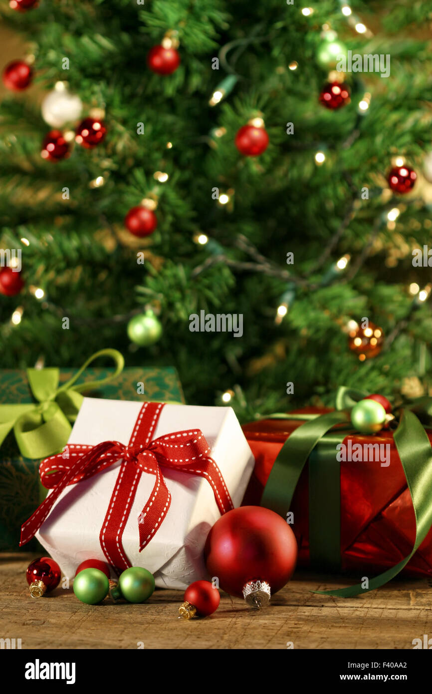 Gifts under the Christmas tree Stock Photo - Alamy
